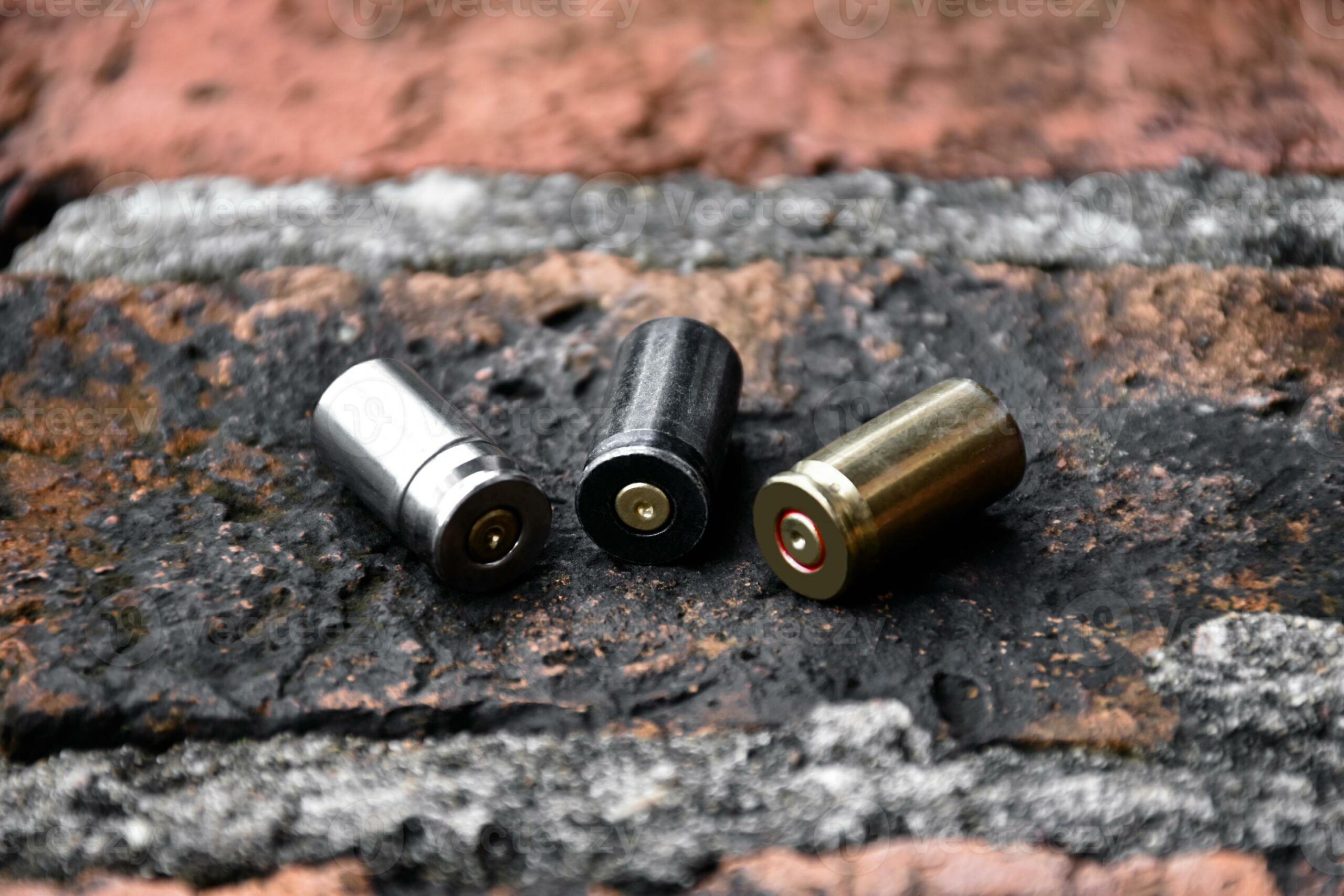9mm-pistol-bullets-and-bullet-shells-on-brick-floor-soft-and-selectivec ...